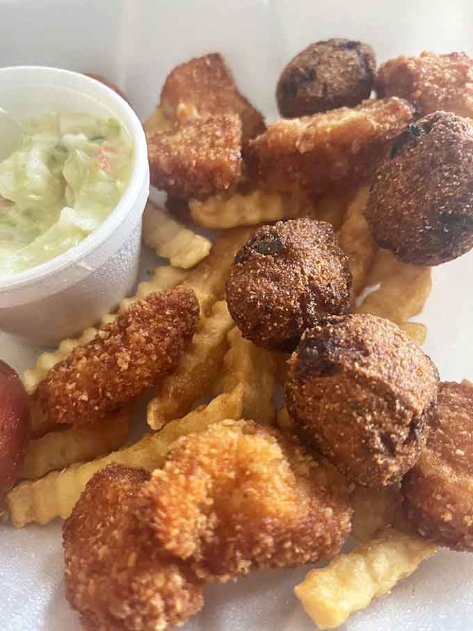Sea scallops, hushpuppies, and fries creating the kind of harmony that makes your taste buds sing.