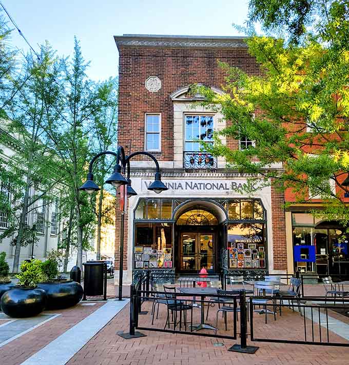 Classic brick architecture meets modern street life, where even the bank building looks like it belongs on a postcard.