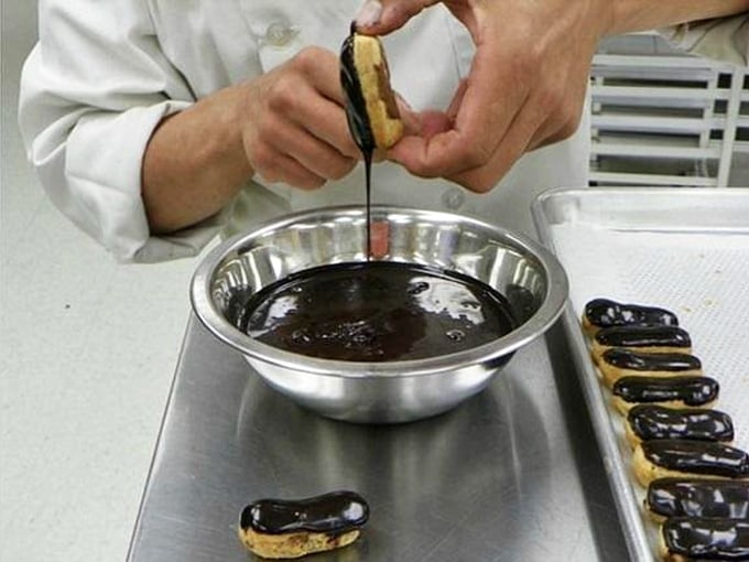 Watching &eacute;clairs get their chocolate coating is oddly mesmerizing, like HGTV but delicious and you can eat the results.