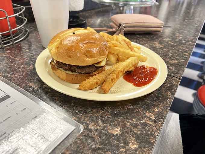 That burger and those golden fries are basically a love letter to your taste buds, signed and delivered.