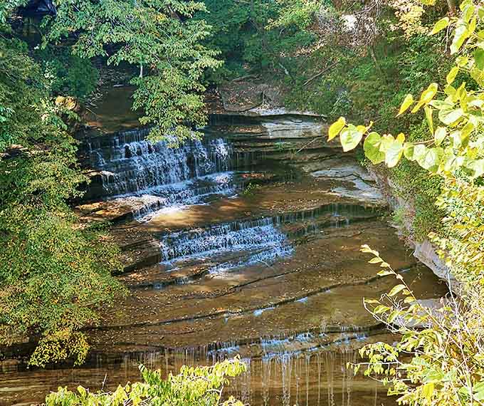 Water cascades over layered rock like nature's own wedding cake, minus the fondant and family drama.