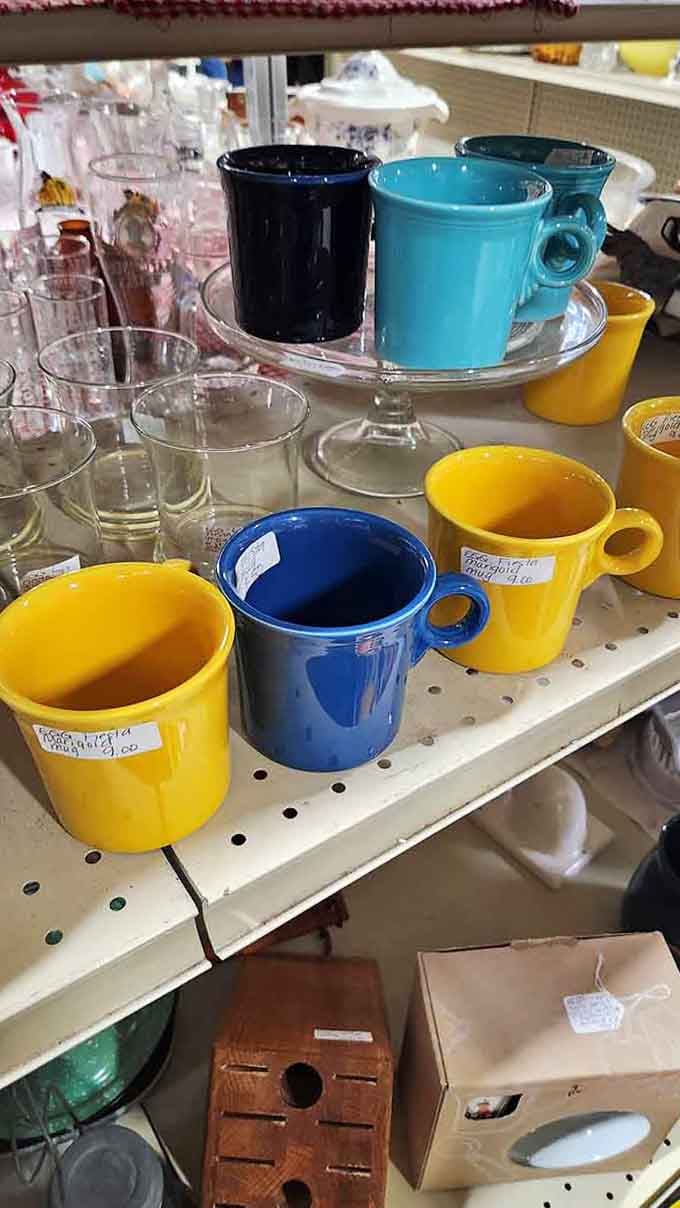 Fiestaware mugs in rainbow colors prove that morning coffee tastes better from vessels with actual personality.