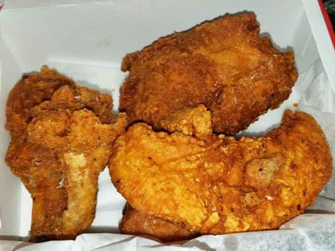 Golden perfection achieved: crispy coating meets tender meat in this beautiful trio of fried chicken pieces.