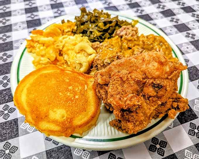 Golden fried chicken, fluffy pancakes, and mac and cheese create a plate that looks like Sunday dinner's greatest hits.