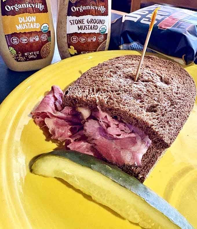 Hot pastrami piled this high should probably require an engineering degree to eat, but it's worth the structural challenge.