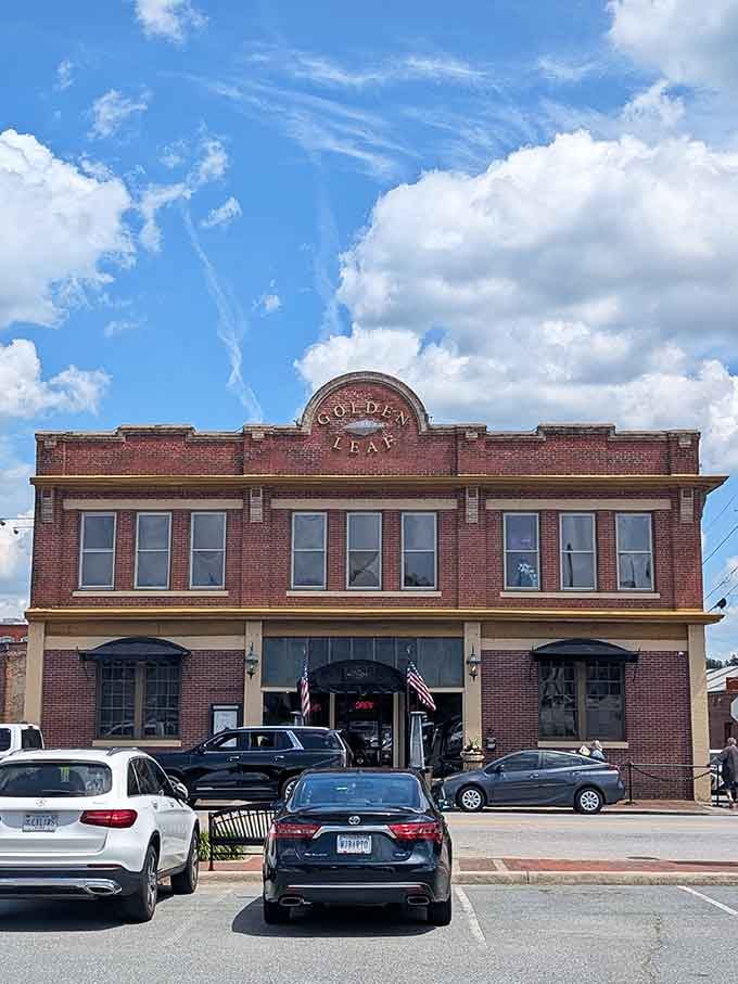 The Golden Leaf building's classic facade and dramatic clouds create a scene worthy of a postcard from better times.