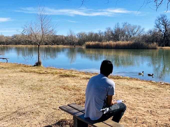 Contemplative moments by the water remind us that sometimes the best activity is simply sitting still and watching ducks paddle by.