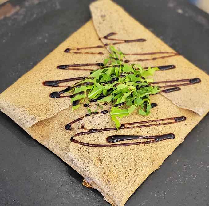 Arugula and balsamic drizzle turn this delicate crepe into edible art worth framing, or eating.