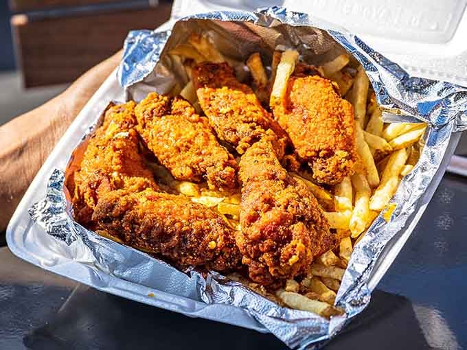 Golden, crispy, and piled high with fries, this is what fried chicken dreams are made of, folks.