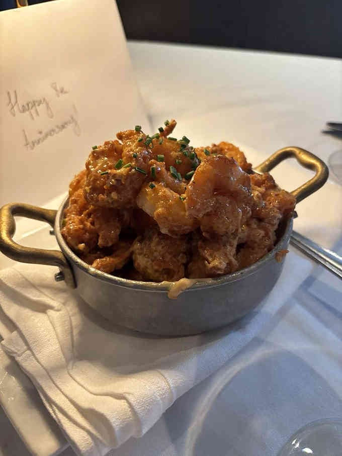 Crispy shrimp that arrives golden and glistening, proving that sometimes the best things come in small, delicious packages.