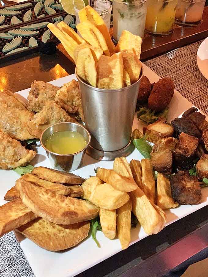 This towering platter of empanadas, croquettes, and crispy delights proves sharing is caring, or optional if you're hungry enough.