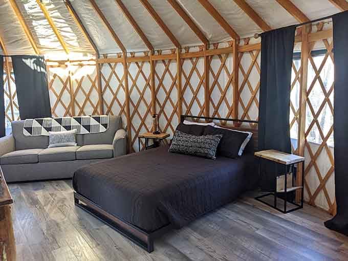 Your bedroom features a proper bed and couch because sleeping on the ground is for people without options.
