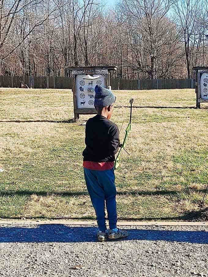 Young archers learning that concentration beats enthusiasm, though both help when aiming at distant targets.