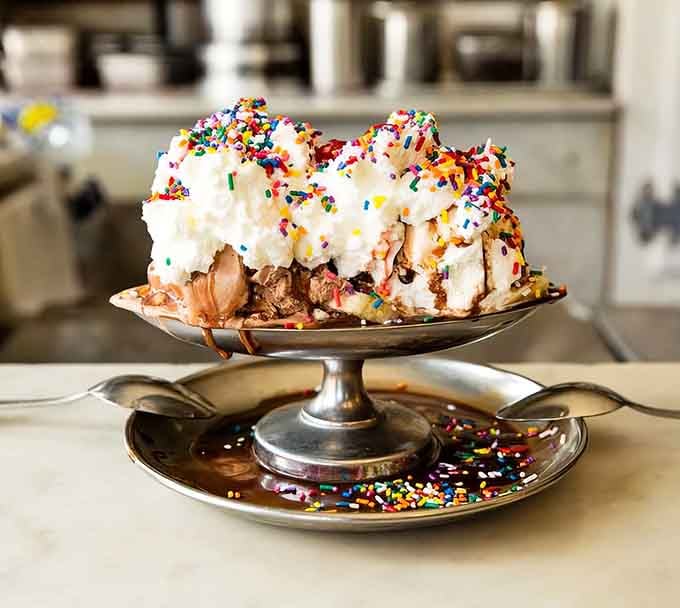 Mountains of whipped cream and sprinkles create landscapes that would make cartographers weep with joy and envy.
