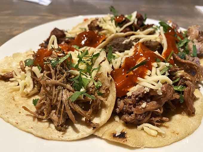 Tender shredded meat piled high on soft tortillas with fresh toppings is taco perfection personified.