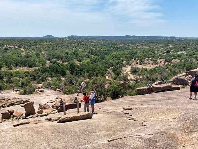 Standing at the top, surveying the Hill Country like you just conquered Everest, only with better barbecue nearby.
