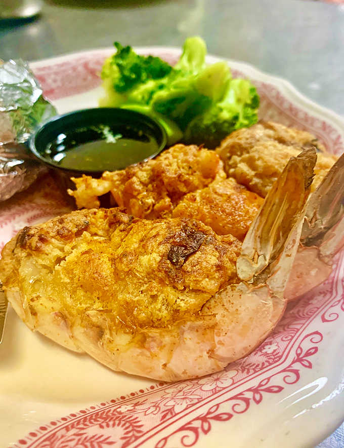 Baked stuffed shrimp that looks like it's ready for its close-up, complete with perfectly golden stuffing.