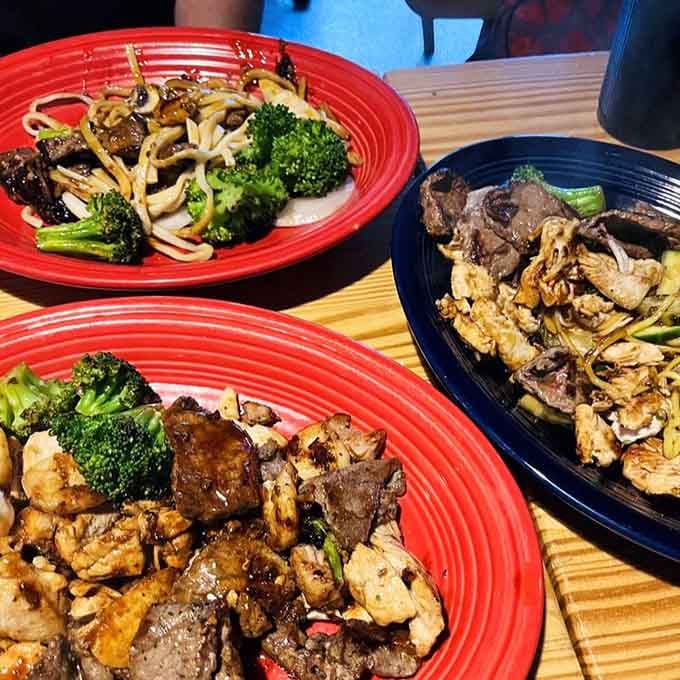 Three bowls of grilled perfection showcasing beef, chicken, and vegetables cooked exactly how you designed them.