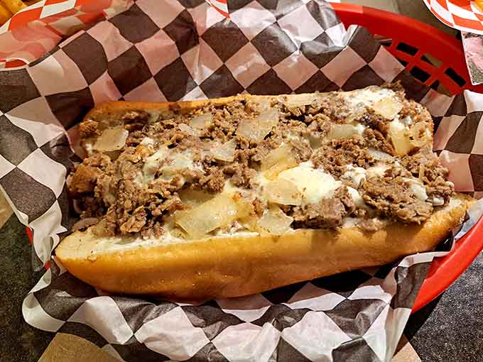Behold the classic cheesesteak in all its glory, piled high with meat and melted cheese perfection.