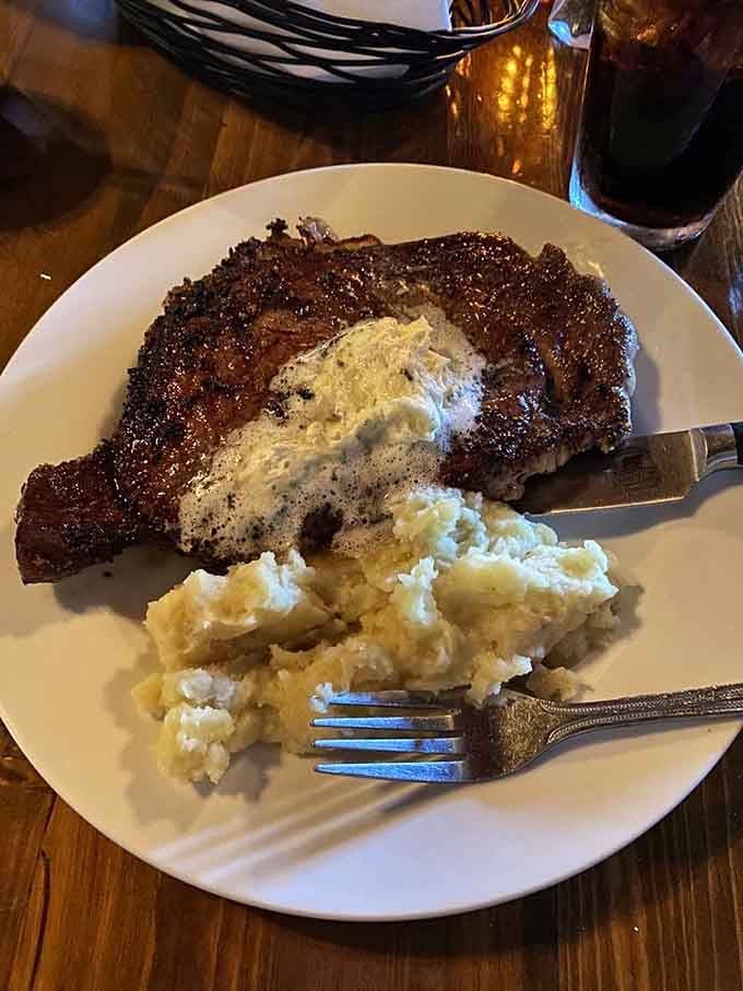The Porterhouse arrives like it owns the place, perfectly crusted and ready to justify every calorie.