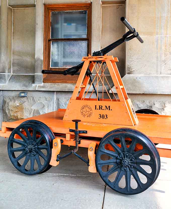 This vintage handcar at the depot reminds you that railroad workers once powered these tracks with pure muscle and determination.