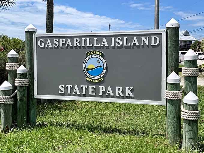 The official welcome sign to paradise, though the white sand ahead does most of the talking.