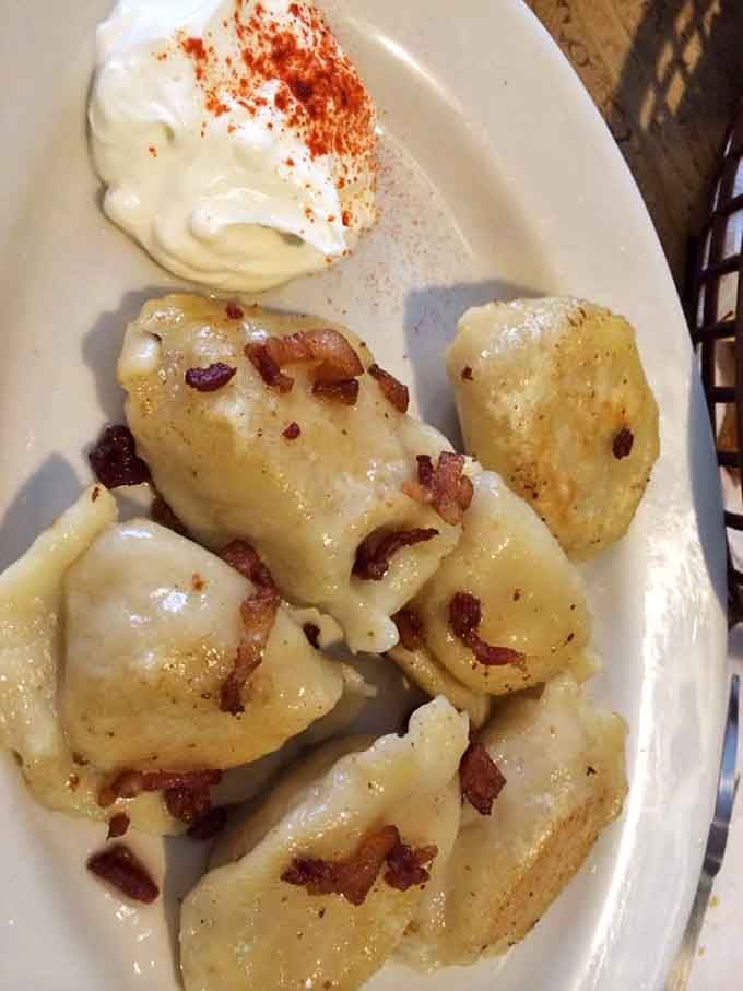 Golden saut&eacute;ed pierogies topped with crispy bacon bits prove that some food combinations transcend all cultural boundaries completely.