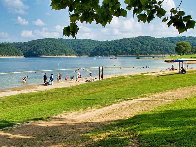 Families gather on sandy shores where building sandcastles and splashing in clear water creates memories that last lifetimes.