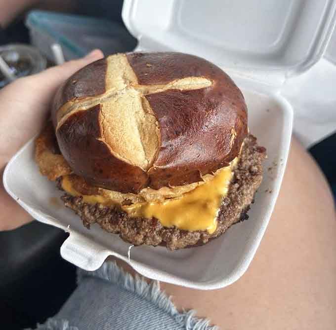 The Haystack burger arrives on a pretzel bun looking like it just won best in show at the county fair.