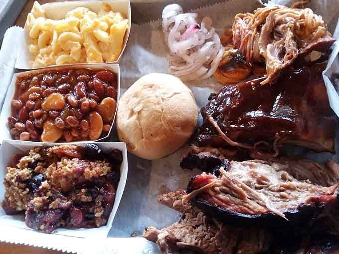 Behold the barbecue feast: ribs, brisket, pulled pork, and sides that prove Ohio knows how to smoke meat properly.