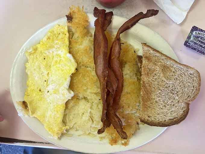 Scrambled eggs, crispy bacon, and hash browns that understand their assignment perfectly, no drama required.