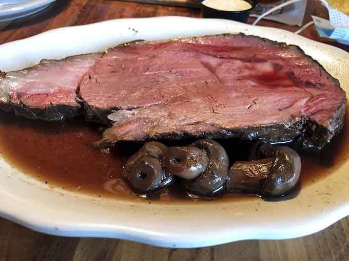 That pink center and mushroom-studded au jus prove why locals plan their Sundays around this prime rib.