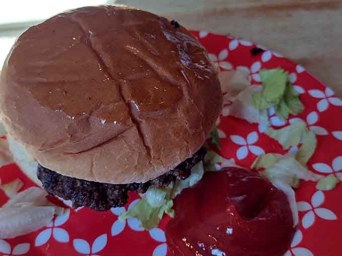 A perfectly grilled burger that proves the best things in life don't need fancy presentation, just honest flavor.