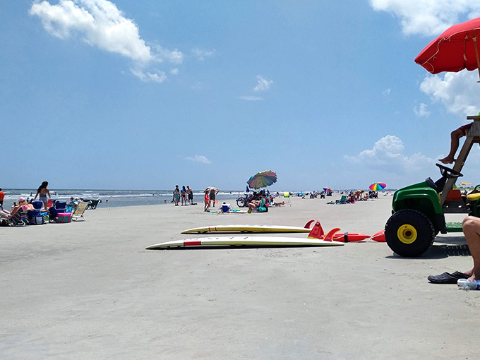Summer crowds enjoying their slice of heaven, proving that even popular beaches can feel spacious when done right.