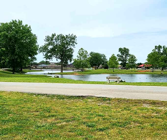 A park bench, a quiet pond, and absolutely nowhere else you need to be right now.