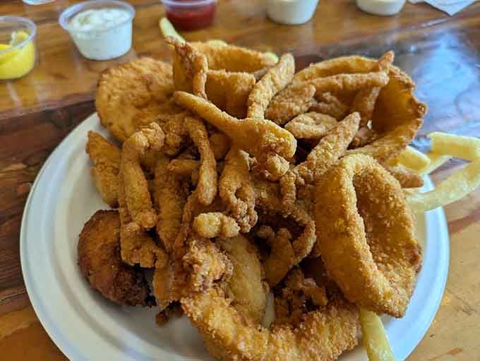 Golden, crispy, and piled high—this seafood platter is what dreams are made of, one crunchy bite at a time.