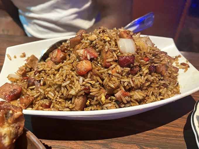 Roast Pork Fried Rice arrives as a mountain of savory perfection that could feed a small village, happily.