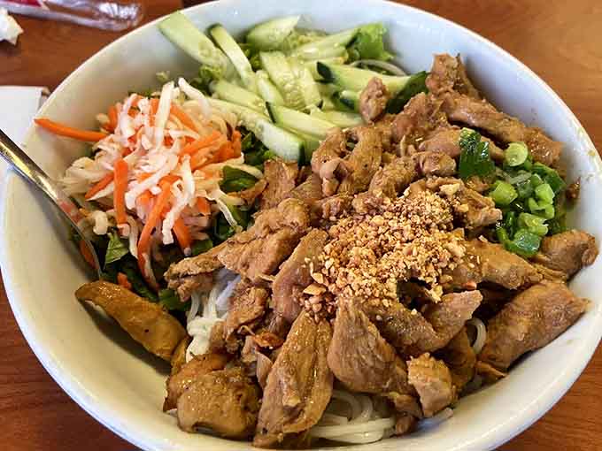 Lemongrass chicken over vermicelli with all the fixings. This bowl has more layers than your favorite mystery novel.