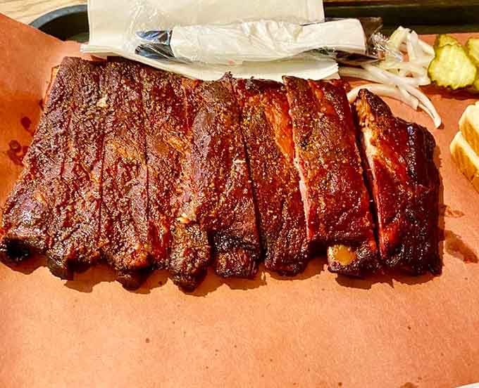 These ribs showcase that perfect bark and tender meat combo that barbecue dreams are absolutely made of.