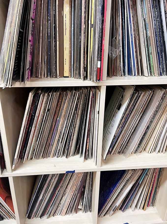 Vinyl records stacked like musical time capsules, each one somebody's former soundtrack to Saturday nights.