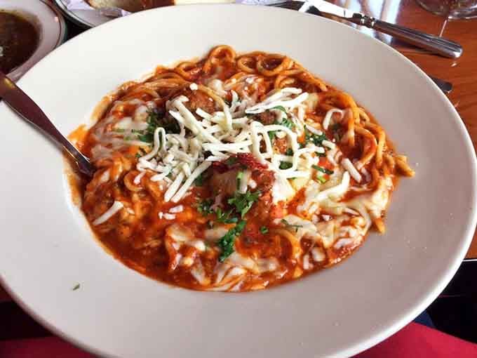The Bolognese that started it all, topped with enough cheese to make any Italian grandmother nod with approval.