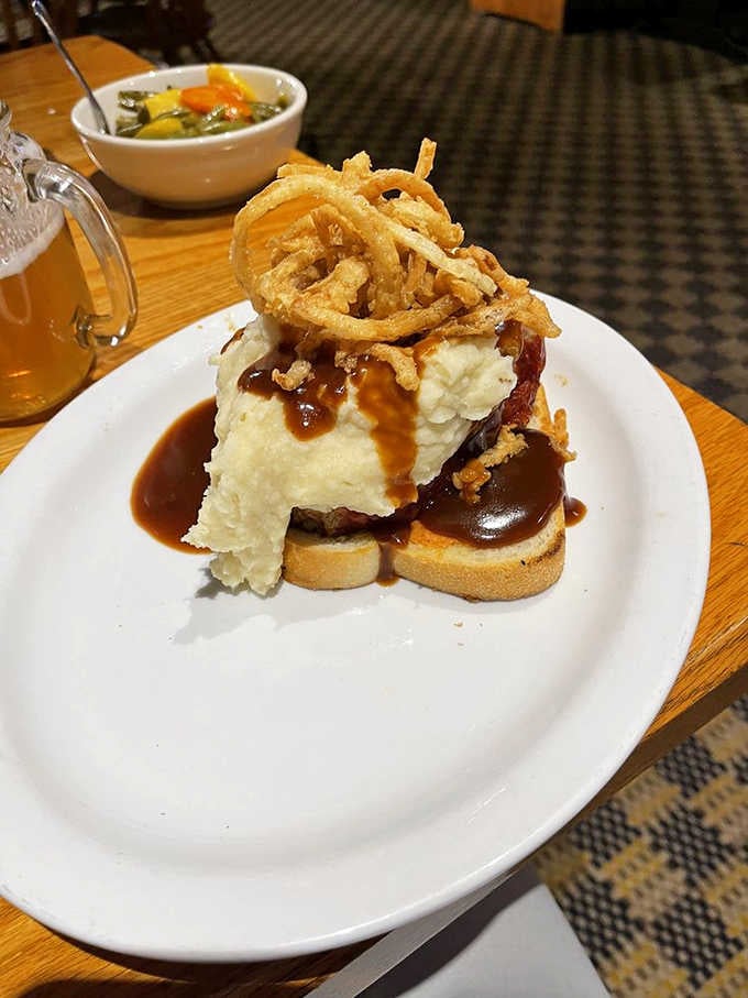 Behold the meatloaf that launched a thousand return visits, complete with its crown of crispy onion strings.