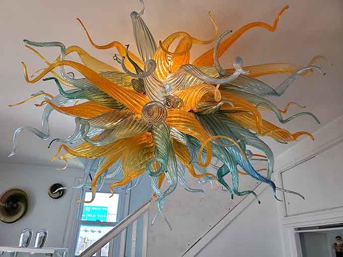 That spectacular chandelier overhead proves what happens when talent, patience, and 2,000-degree temperatures collaborate beautifully.