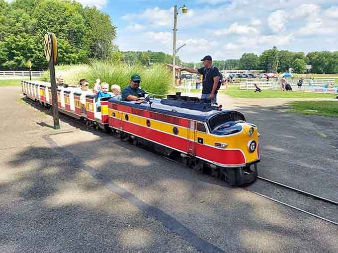 All aboard the pint-sized express where conductors wear baseball caps and passengers grin wider than the track itself.