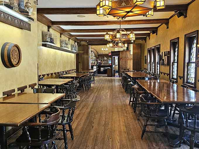 The tasting hall stretches invitingly, where wooden benches have welcomed generations of thirsty visitors.
