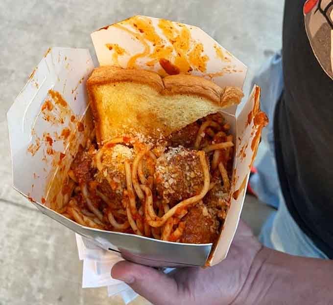 This beautiful mess of spaghetti and meatballs arrives in a to-go container that's about to become your new best friend for the next fifteen minutes.