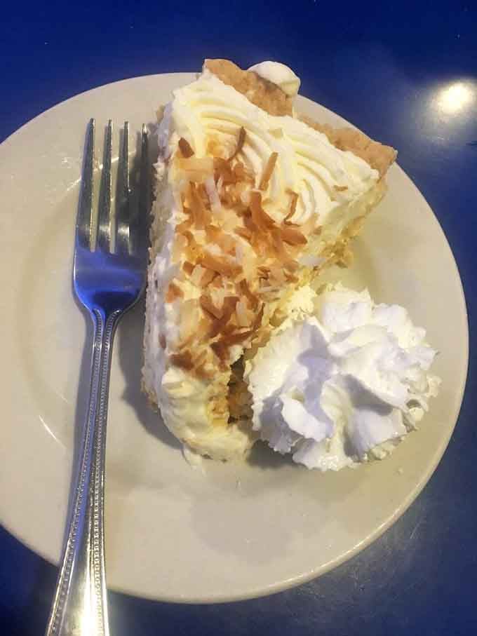 Coconut cream pie piled high with toasted coconut and whipped cream is pure nostalgic heaven on a plate.