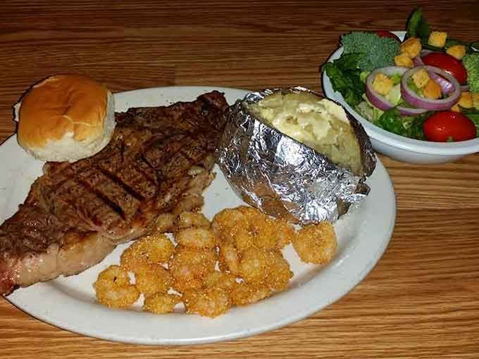 That steak with fried shrimp and baked potato is basically a Southern surf-and-turf dream come true.