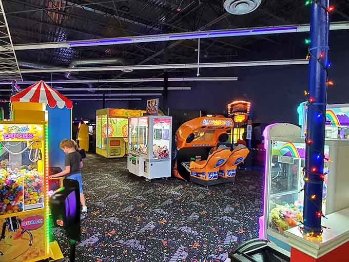 The arcade floor beckons with flashing lights and possibilities, where kids become racing champions and claw machine strategists in minutes.