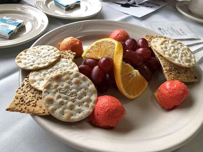 This elegant cheese and fruit plate sets the stage perfectly, proving that even detectives need proper fuel for their investigative work.